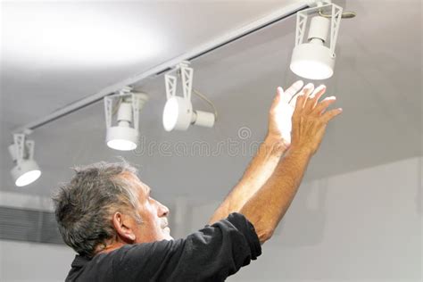 Electrician Caucasian Man Worker Installing A Ceiling LED Spotlight Stock Photo Image Of Hands