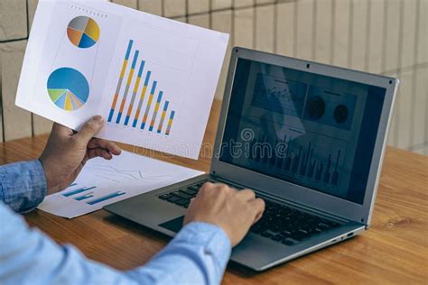 Businessman Hands On Keyboard Of Laptop Computer Showing Data Analysis