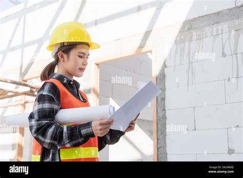 Asian Engineer Architect Worker Woman Holding Blueprint Infrastructure