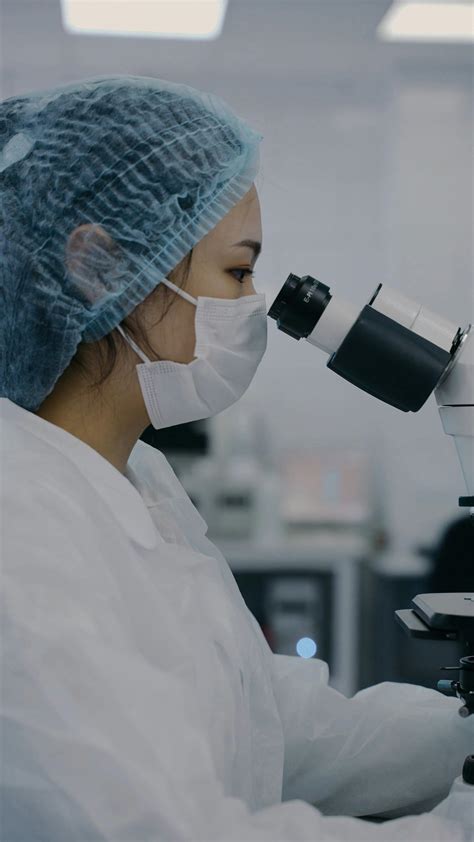 A Woman Using Microscope · Free Stock Video