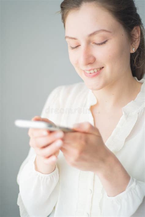 A Young Woman Using Voice Recording Of Voice Recognition Phone On Smartphone Drives Smart Home