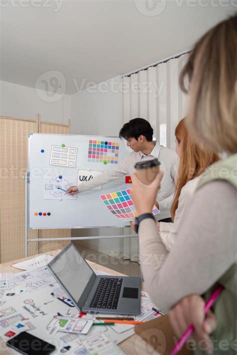 Creative Ux Developer And Ui Designer Brainstorming Session With Color Palettes And Wireframes