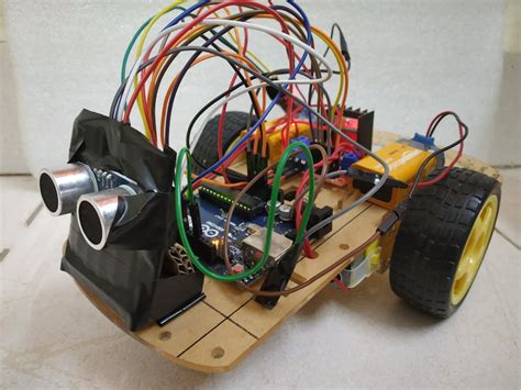 Voice Controlled Obstacle Avoidance Robotic Car Using Mobile