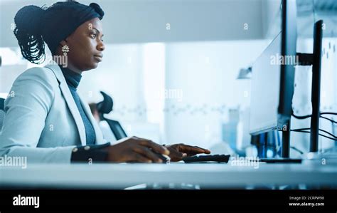 Beautiful Female Engineer Working On Personal Computer In The High Tech Industrial Factory Busy