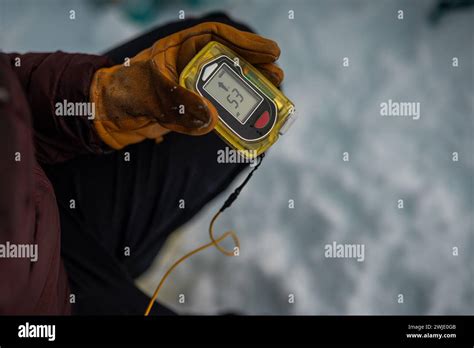 Person Holding A Modern Avalanche Beacon In His Hands Off Piste Skier
