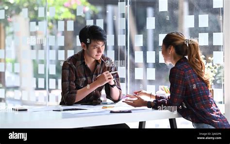 Focused Creative Team Brainstorming And Working Together For Mobile Application Software Design