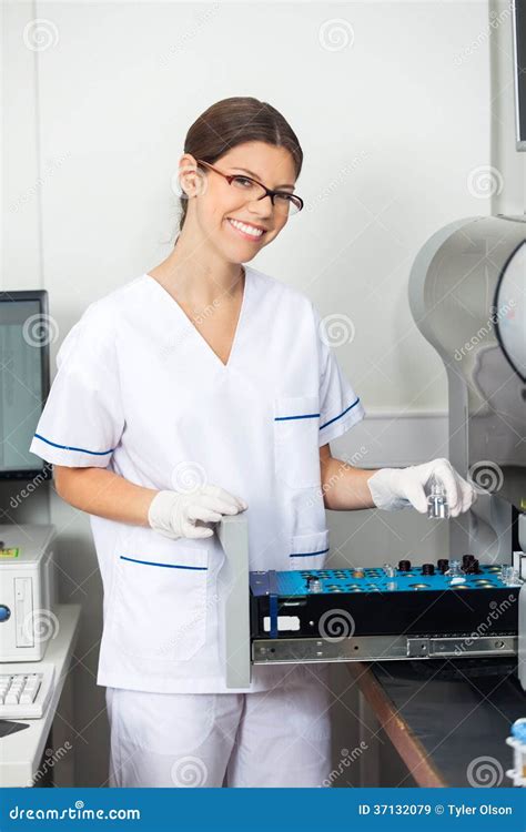 Researcher Loading Solutions Into Analyzer Stock Image Image Of