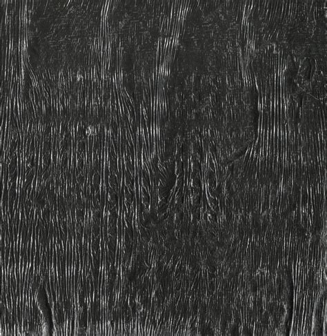 Premium Photo Crumpled Polyethylene On A Black Surface