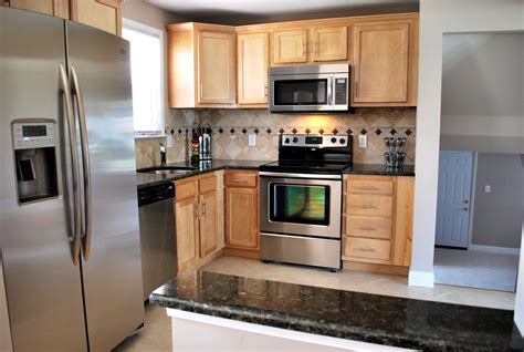 Brown Kitchen Cabinets With Stainless Steel Appliances The Tube