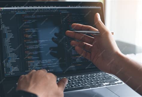 Premium Photo Software Developer Coding Javascript On Laptop Computer