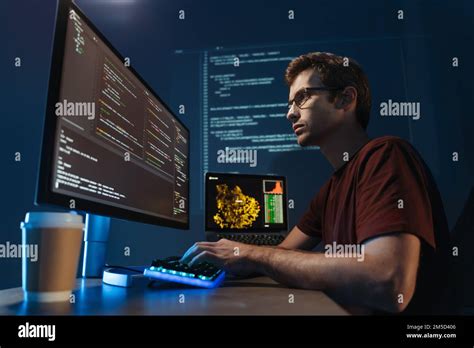 Side View Portrait Of Modern It Developer Using Computer At Home Office