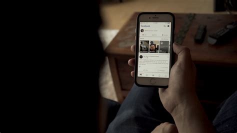 Man Using Iphone With Facebook App Open Stock Footage Sbv 334057243