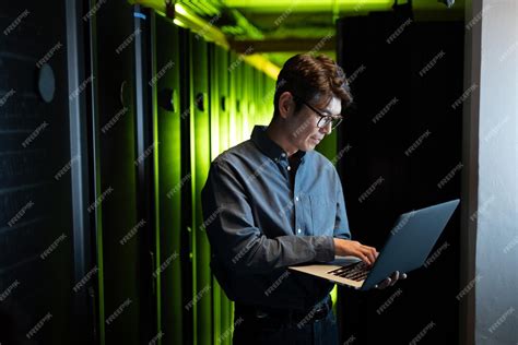 Premium Photo Asian Male Engineer Using Laptop In Computer Server