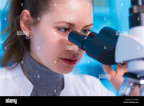 MODEL RELEASED Female Scientist Using Microscope Stock Photo Alamy