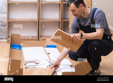 Furniture Production And Assembling Attentive Master Unpacking Box And