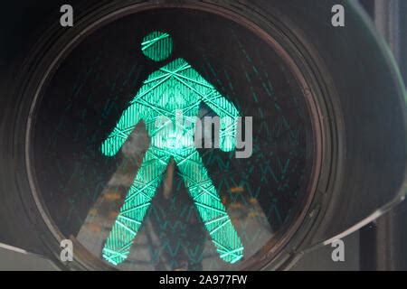 Green Man Pedestrian Traffic Signal For Crossing The Road In Paris