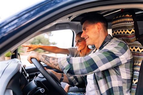 Premium Photo Man And Woman Driving A Camper Van During