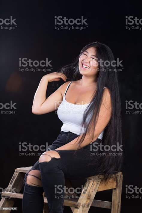 Beautiful Curvy Model With Dark Hair And Cheerful Personality In A