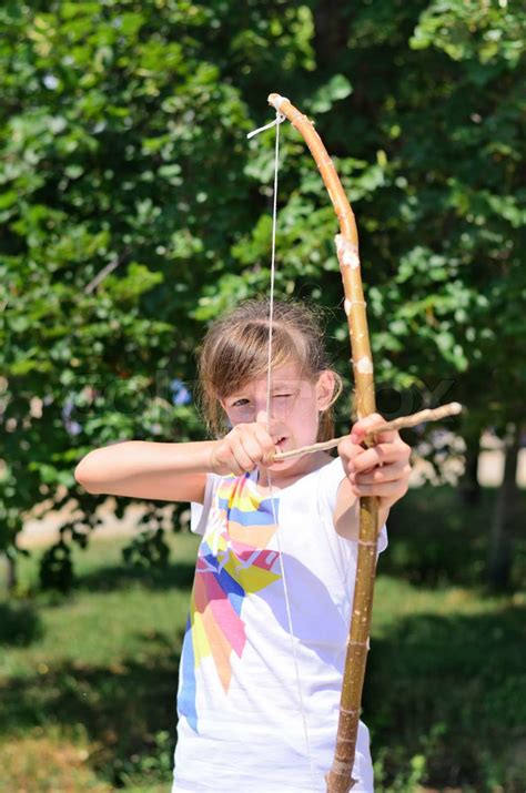 Babe Girl Practising With A Bow And Arrow Stock Image Colourbox