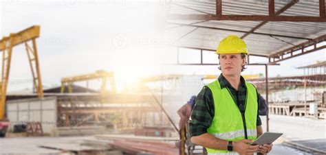Engineer Man In Hardhats With Tablet On Construction Site Foreman Checking Project At The