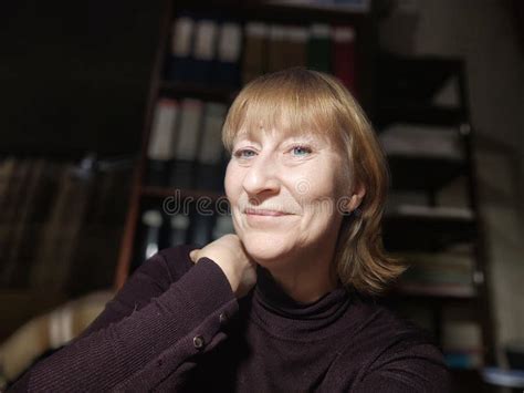 Middle Aged Woman Shares A Cheerful Selfie While Smiling At Her Home Office Stock Photo Image