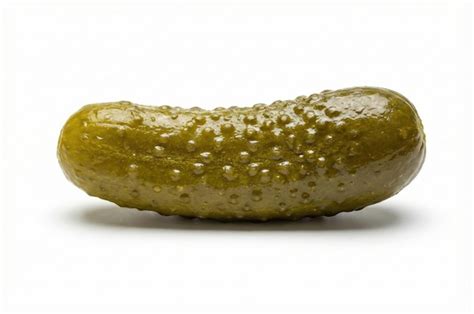 Single Green Pickle On White Background Premium Photo