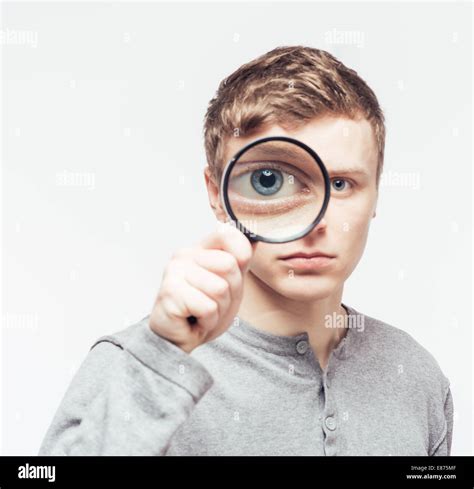 Man Searching With Magnifying Glass