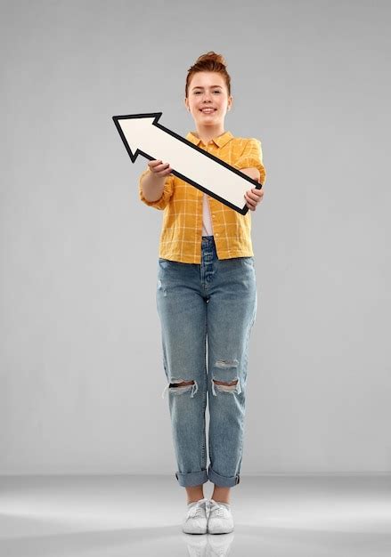 Premium Photo Teenage Girl With Arrow Shows North West Direction