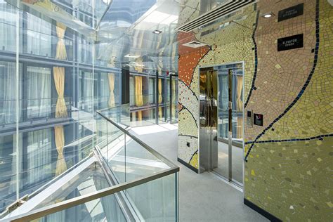 Transparent Hotel Features Sharp Corners Mosaic Tiled Walls And Copper