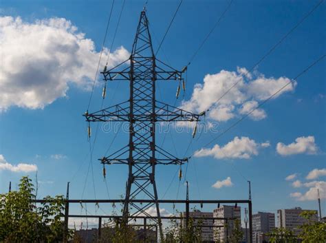 High Voltage Electric Transmission Line And Pylon Against Cityline Stock Image Image Of