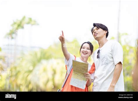 Man And Woman Pointing With Map Stock Photo Alamy
