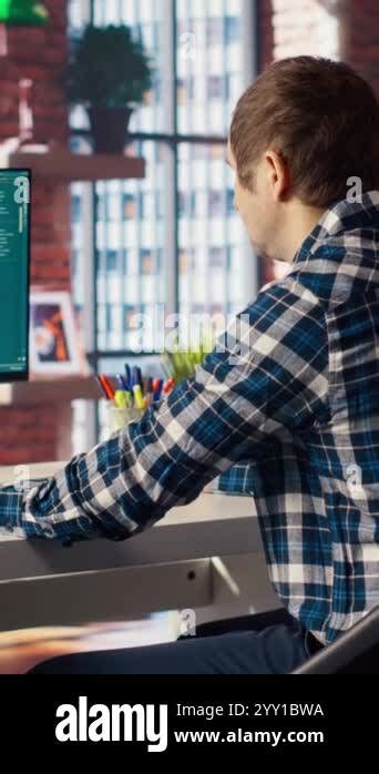 Man Seated At Desk Using Ai Llm Chatbot Software In Modern Urban Home Office Person Requesting