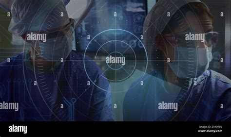 Image Of Round Scanner Against Diverse Male And Female Surgeons Performing Surgery At Hospital