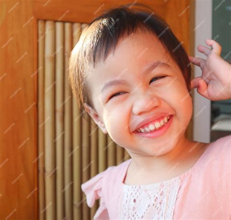 Premium Photo Portrait Of Cute Girl Smiling Premium Photo Portrait Of Cute Girl Smiling