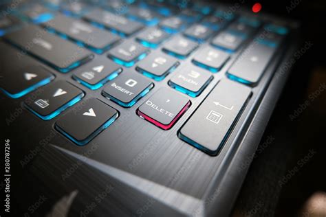 The Gaming Keyboard Shines With Multi Colored Keys Delete Button In Center Stock Photo Adobe
