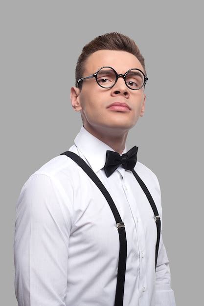 Premium Photo Confident And Intelligence Portrait Of Serious Young Nerd Man In Bow Tie And