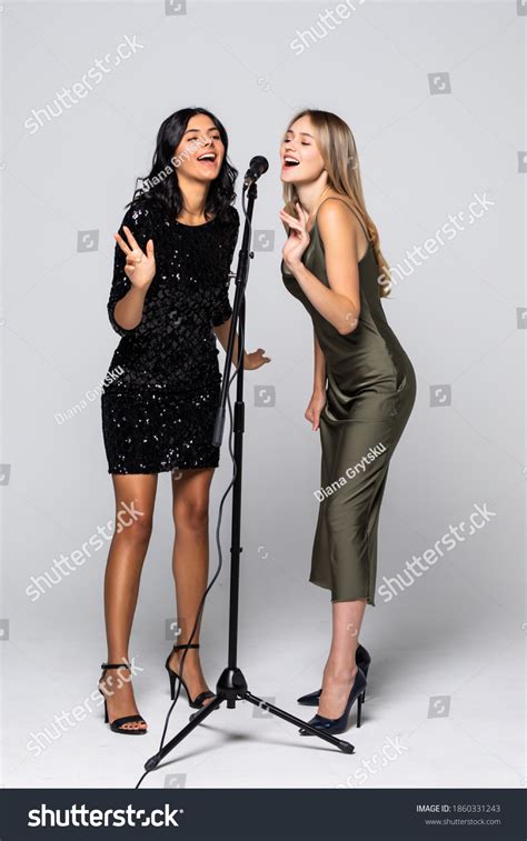 Two Sensual Girls Singing Microphone Isolated Foto Stok Shutterstock