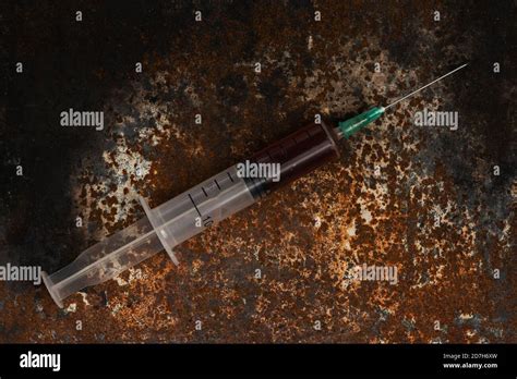 Syringe And Drugs On Dirty Rusty Background Injection Syringe Addiction Stock Photo Alamy