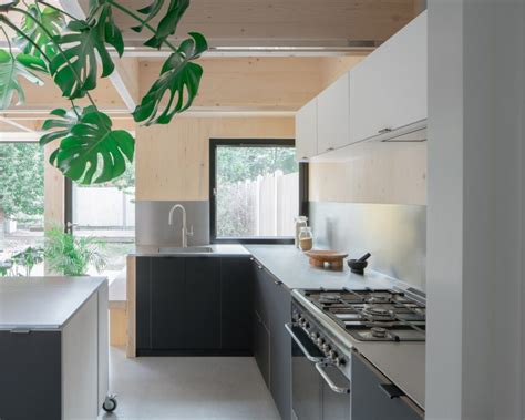 Unknown Works Finishes Clt House Extension With Bright Yellow Render