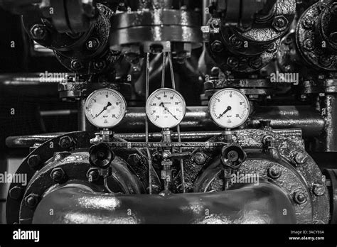 Detailed View Of Three Pressure Gauges On An Industrial Machinery In A