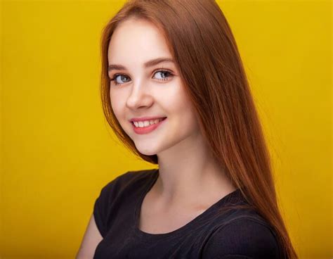 Premium Photo The Concept Of Beauty Red Hair Girl On Yellow Background