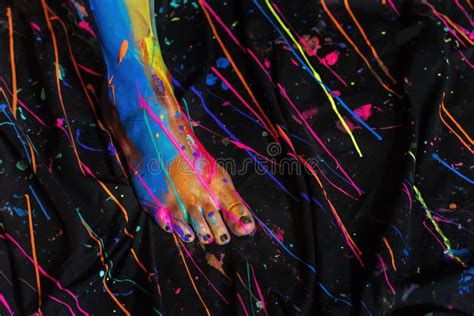 Naked Female Is Being Painted With Colorful Paint In A Home Environment