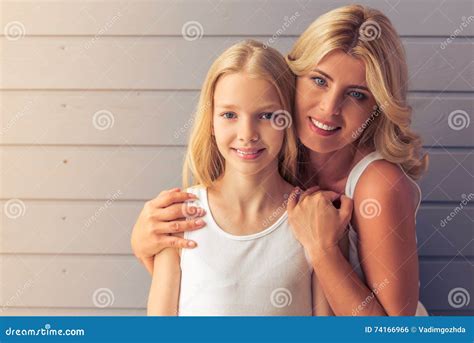 Young Beautiful Mother And Her Cute Teen Daughter Just