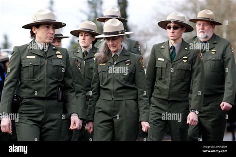 Mount Rainier National Park Rangers Walk In A Procession To A Memorial