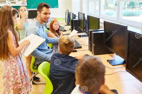 Teacher Explaining Students In Computer Class Stock Image Image Of