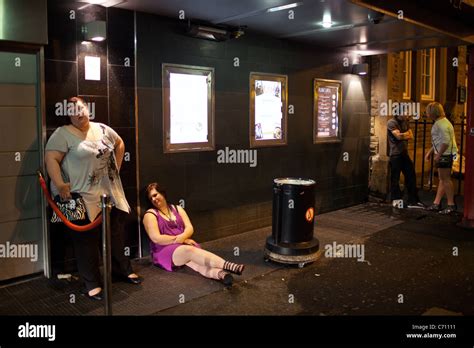 Tired Young Girls Outside A Night Club On A Night Out In Blackpool
