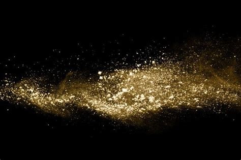 검은 바탕에 황금 가루 폭발입니다 프리미엄 사진 사진