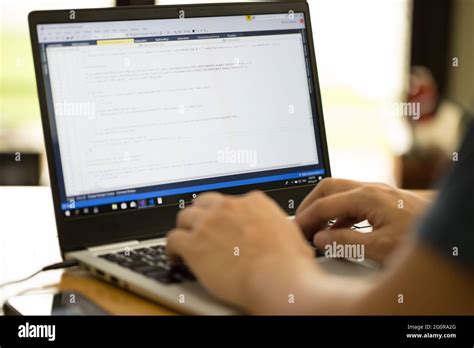 Freelance Programmer Or Developer Working At Home And Typing Source