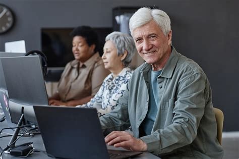 Premium Photo Portrait Of White Haired Senior Man In Computer Class For Elderly Smiling At