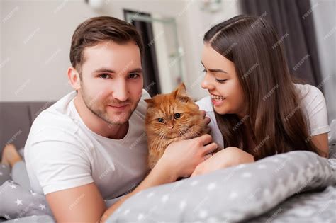 Premium Photo Happy Sensual Young Couple Lying In Bed Together